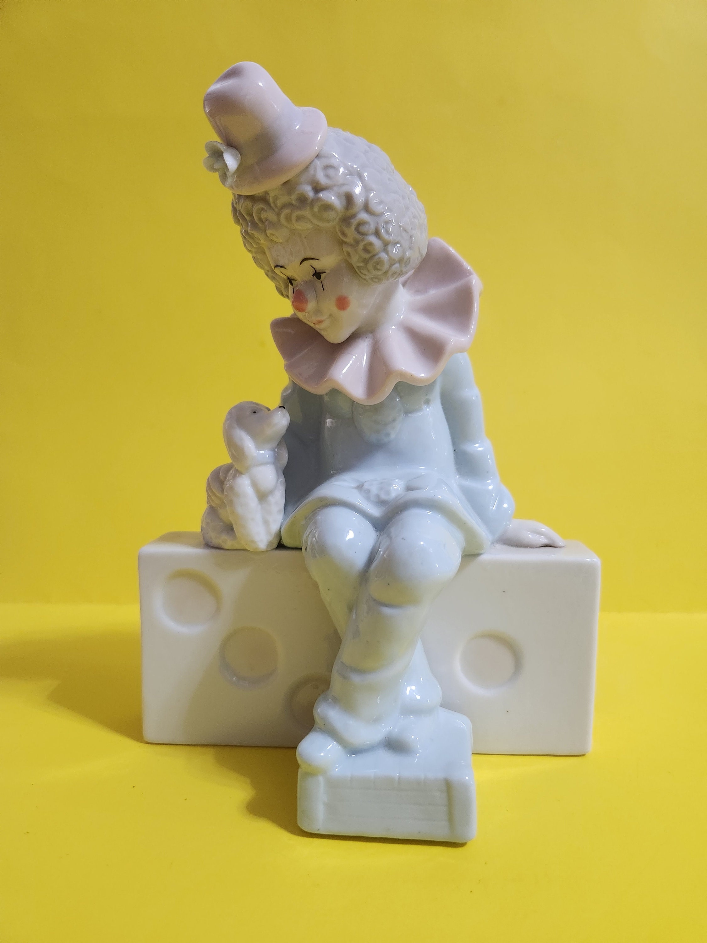Porcelain Pastel Colored Clown Figurine Featuring a Clown Sitting on a ...