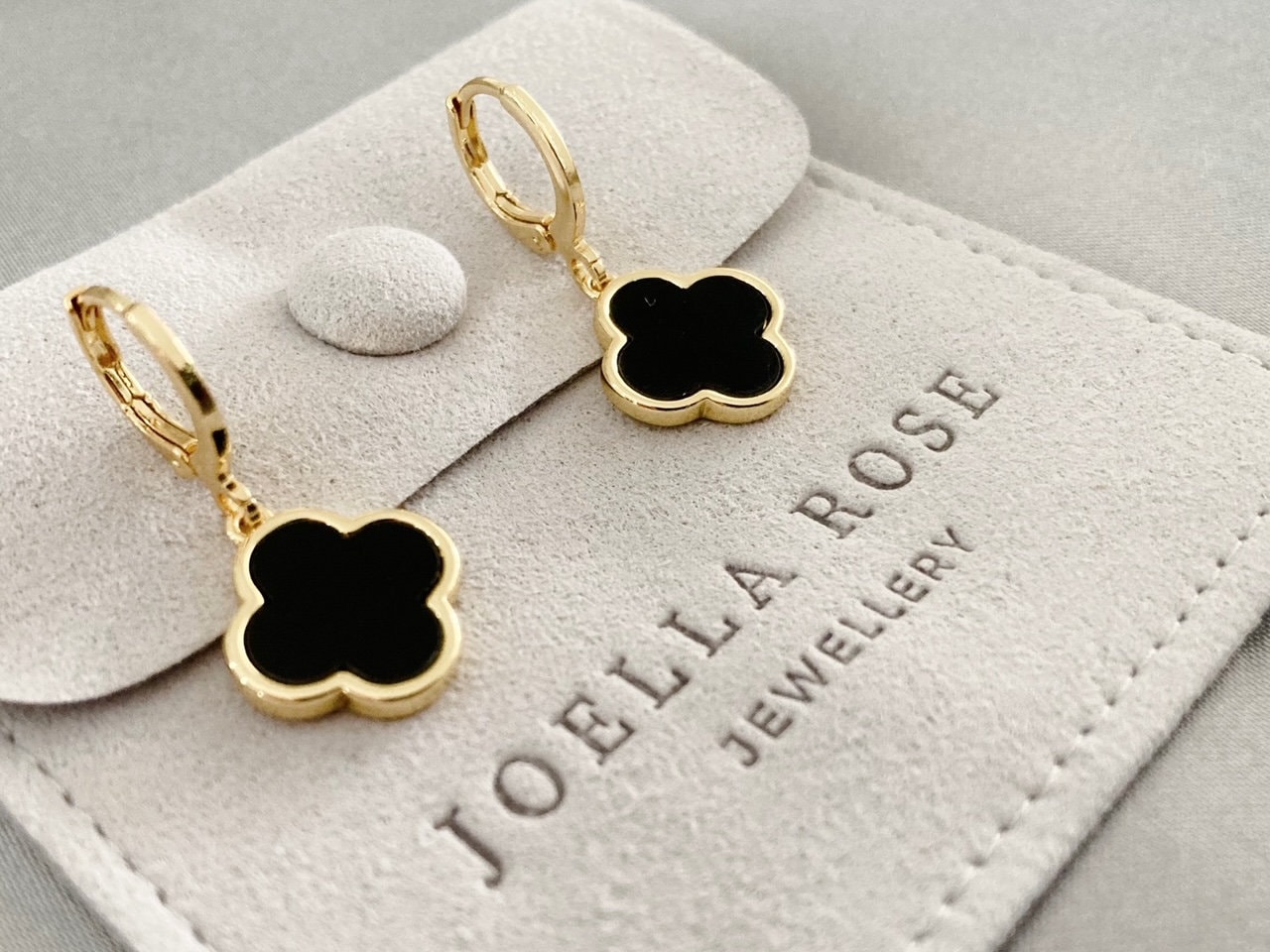 Black clover earrings store