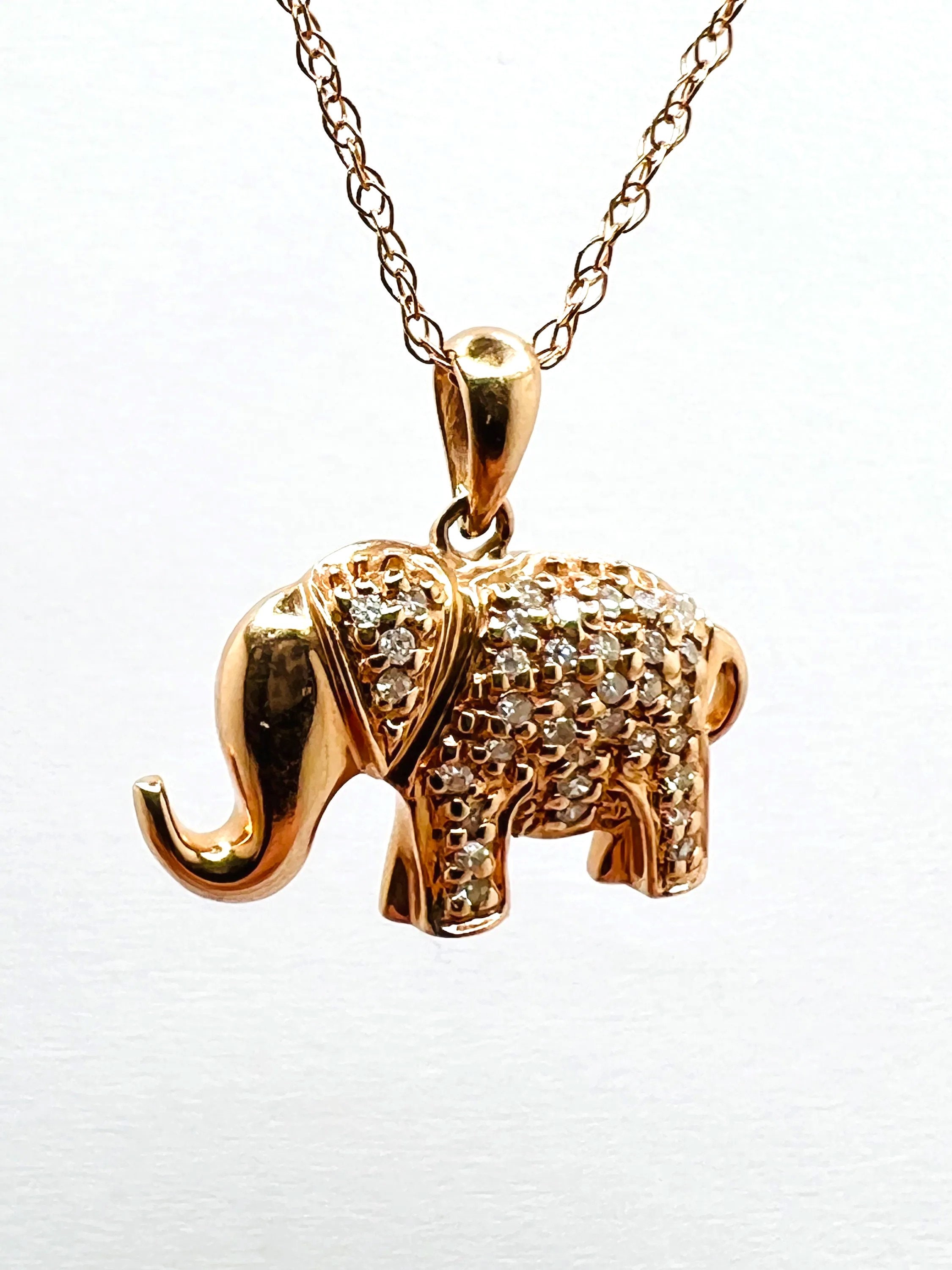 Gold elephant necklace with diamonds store