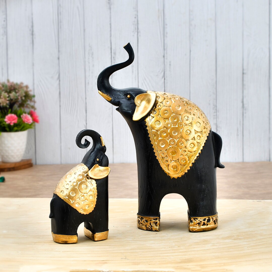 Pair of Black and Gold Elephant Statues Sitting on Table - Etsy