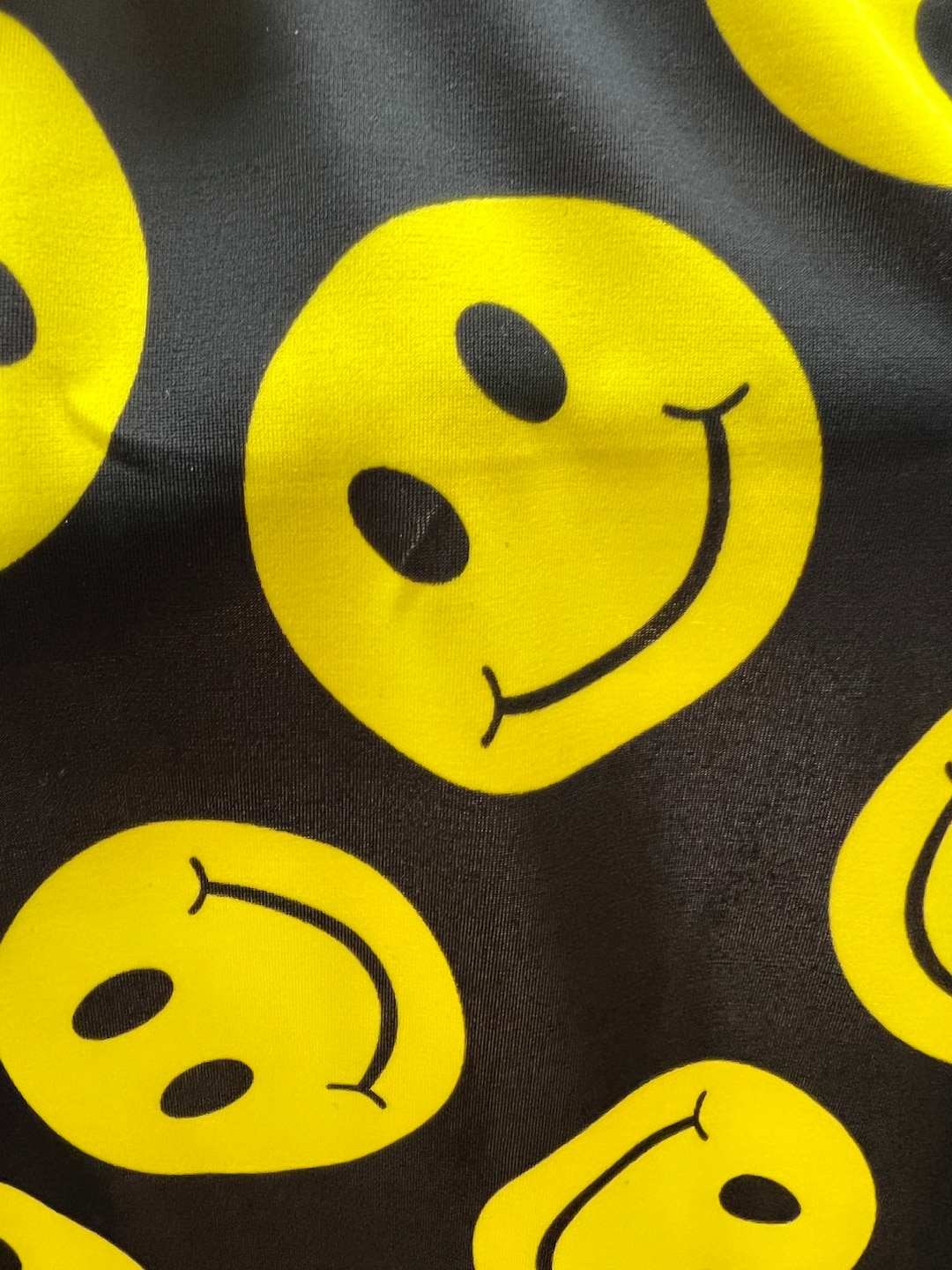 Yellow Happy Face Print on Black Four Way Stretch Nylon Spandex Fabric ...