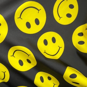 Yellow Happy Face Print on Black Four Way Stretch Nylon Spandex Fabric ...
