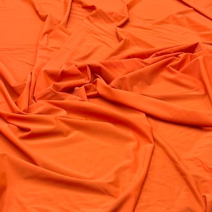 Solid Matte Orange Four Way Stretch Nylon Spandex Fabric by the Yard ...