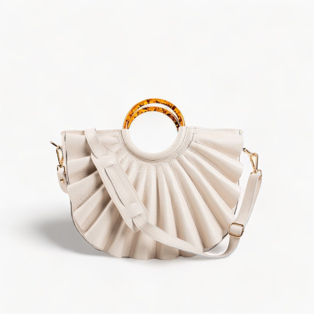 Leather Bag With Bone Rings Handles and a Shoulder Strap in a Beige ...