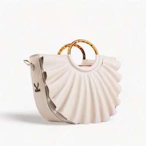 Leather Bag With Bone Rings Handles and a Shoulder Strap in a Beige ...