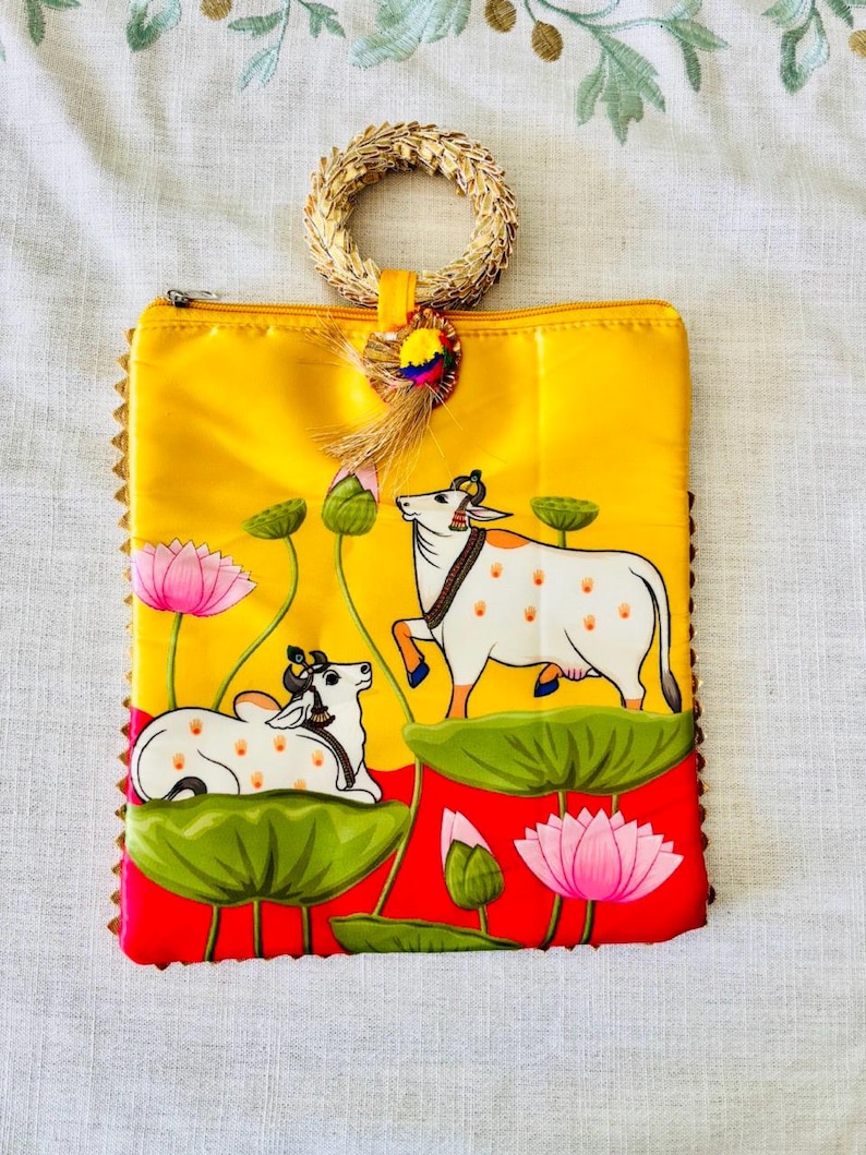Assorted and Colorful Lotus and Cow Pichwai Print Silk Potli Bags ...