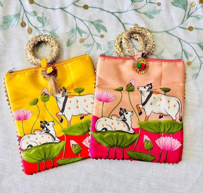 Assorted and Colorful Lotus and Cow Pichwai Print Silk Potli Bags ...