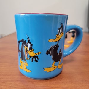 1998 Warner Brothers Studio Daffy Duck Coffee Mug and Four Plastic ...
