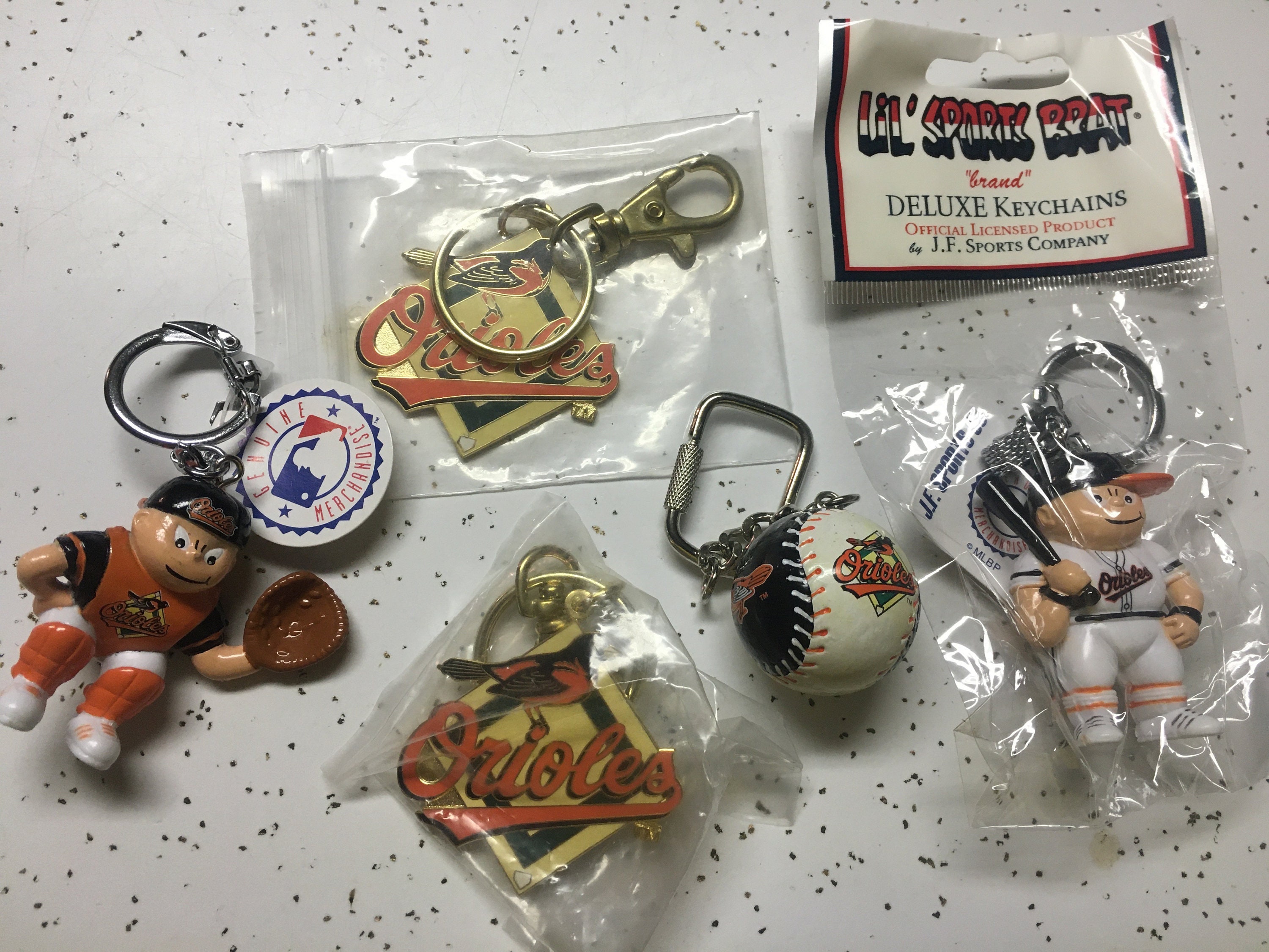 Set of Lil' Sports Brat Keychains, Batter Catcher and Ball. 2 of the ...