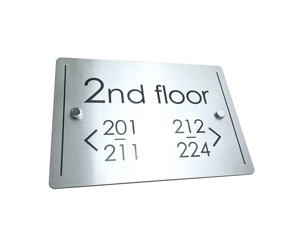 Directional Signs In Hallway