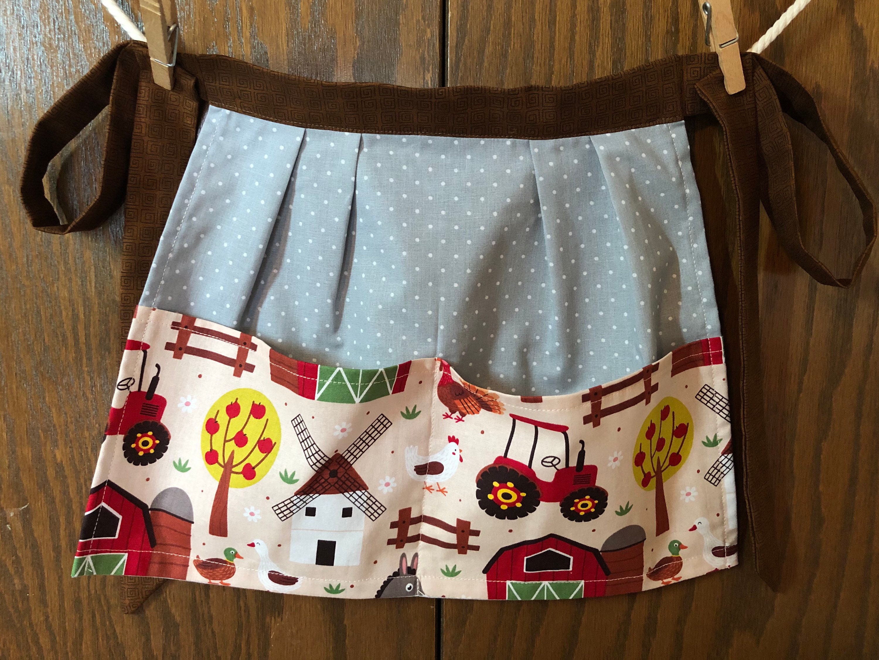 Farming Scene Graces These Adorable Aprons, Complete With Barn, Tractor ...