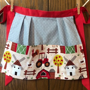 Farming Scene Graces These Adorable Aprons, Complete With Barn, Tractor ...