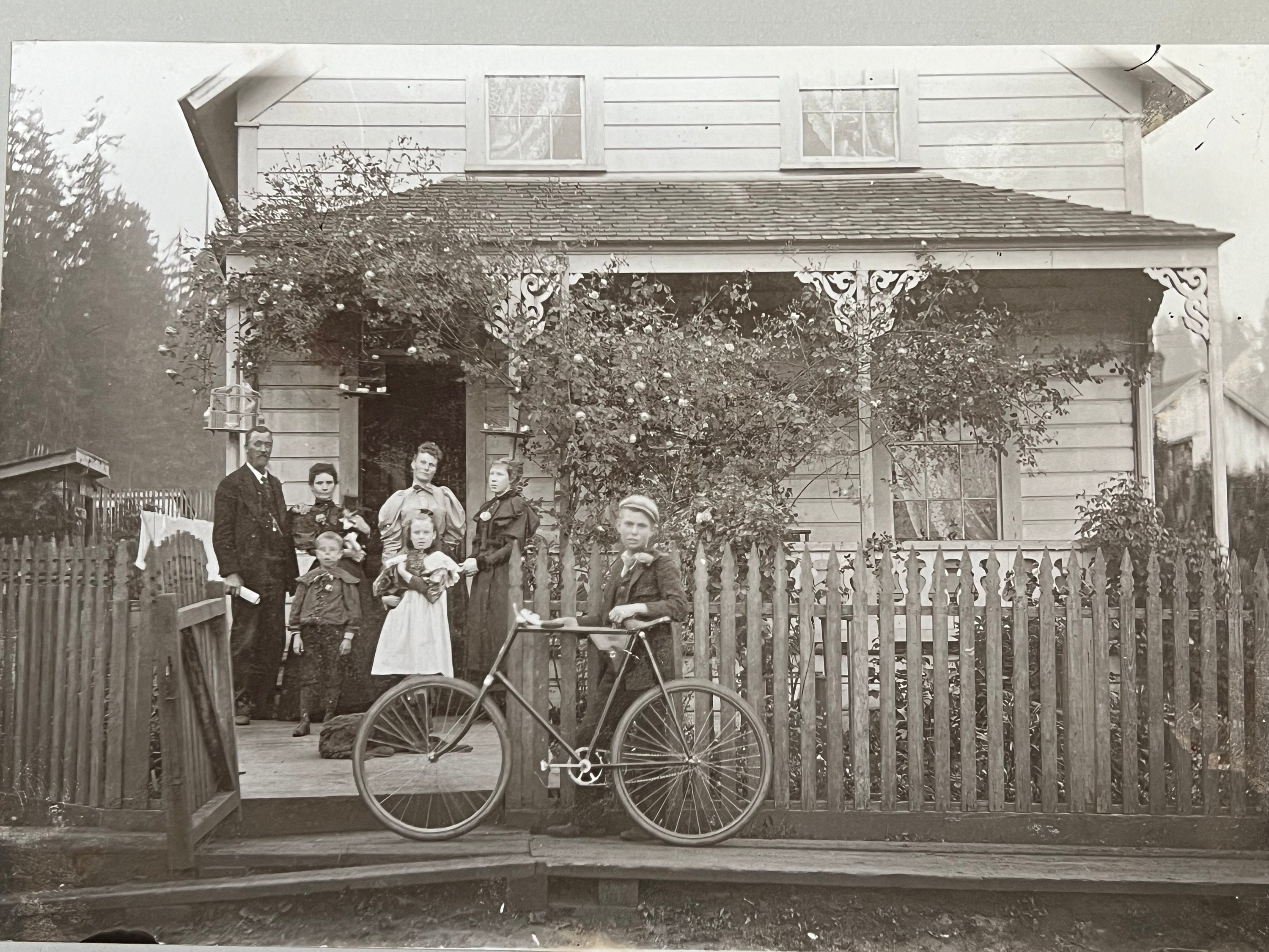 Paperboy in Route! Cute Young Man on Bike With Family and Old House ...