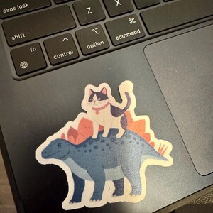Cute Cat Riding Dinosaur Sticker Fun and Whimsical Vinyl Decal for ...