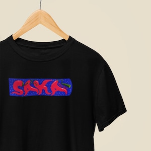 Bukayo Saka Nando's Peri Peri Sauce Arsenal Little Chilli Graphic Tee ...