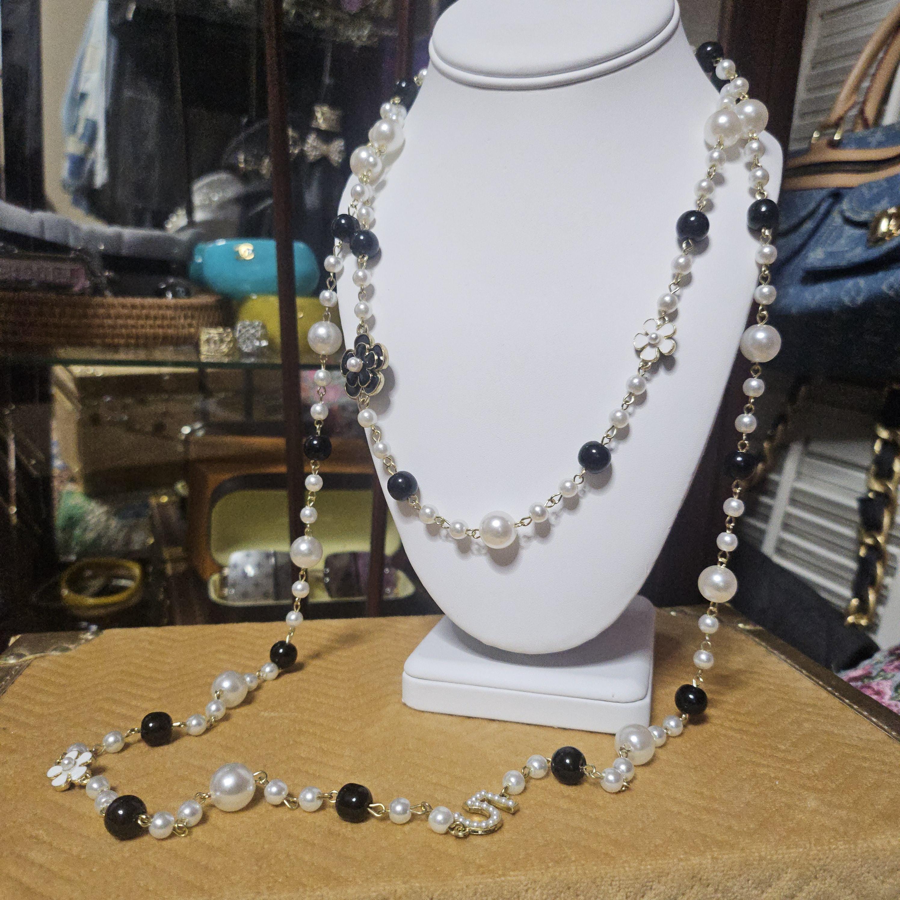Chanel pearl necklace price store