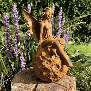 Gorgeous Garden Fairy - Cast Iron Elf Sitting on a Sphere of Flowers ...