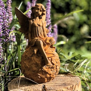 Gorgeous Garden Fairy - Cast Iron Elf Sitting on a Sphere of Flowers ...