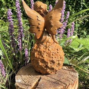 Gorgeous Garden Fairy - Cast Iron Elf Sitting on a Sphere of Flowers ...