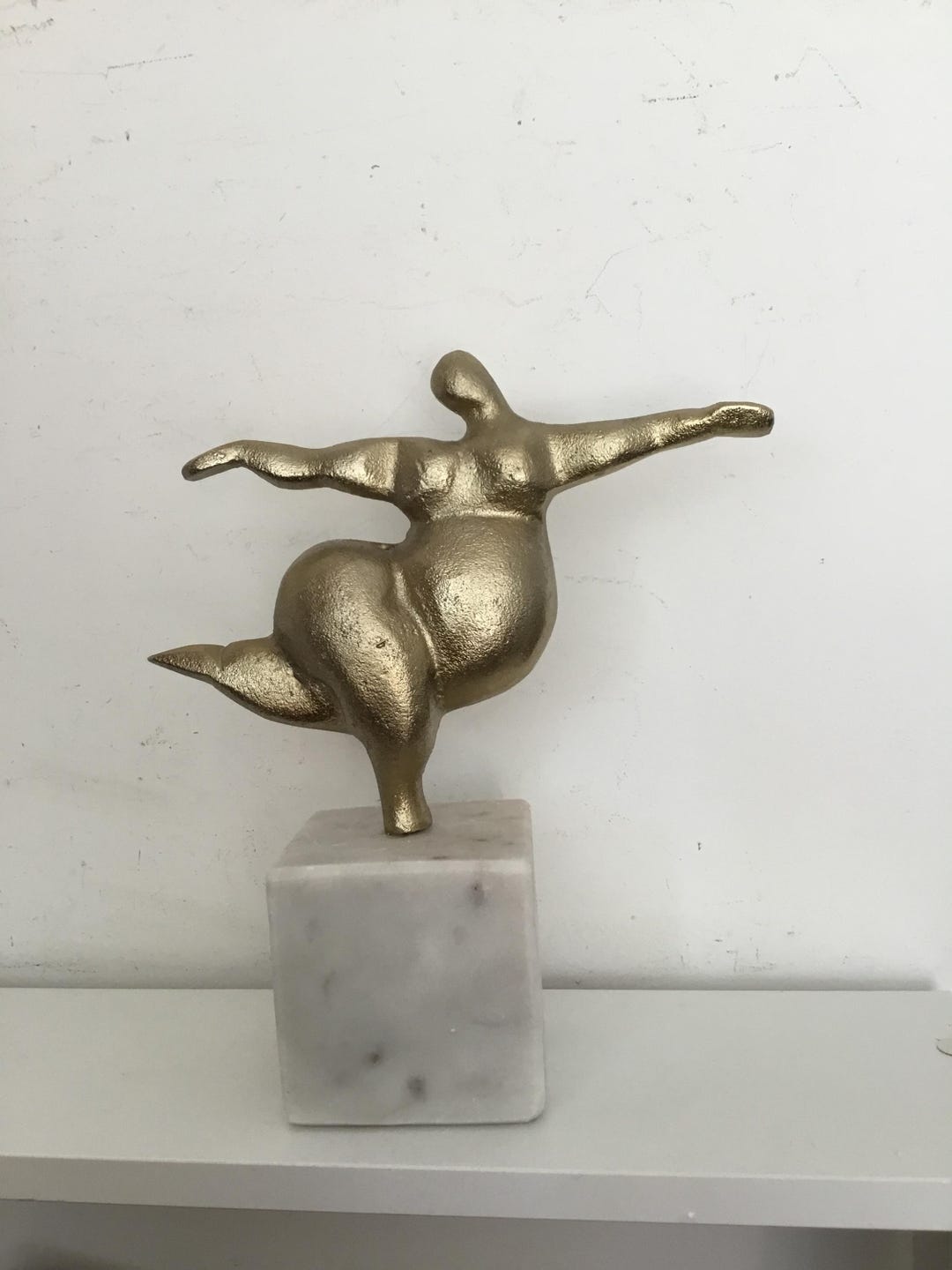 Small Gold Metal Statue of Graceful Dancing Lady on White Stone Base ...