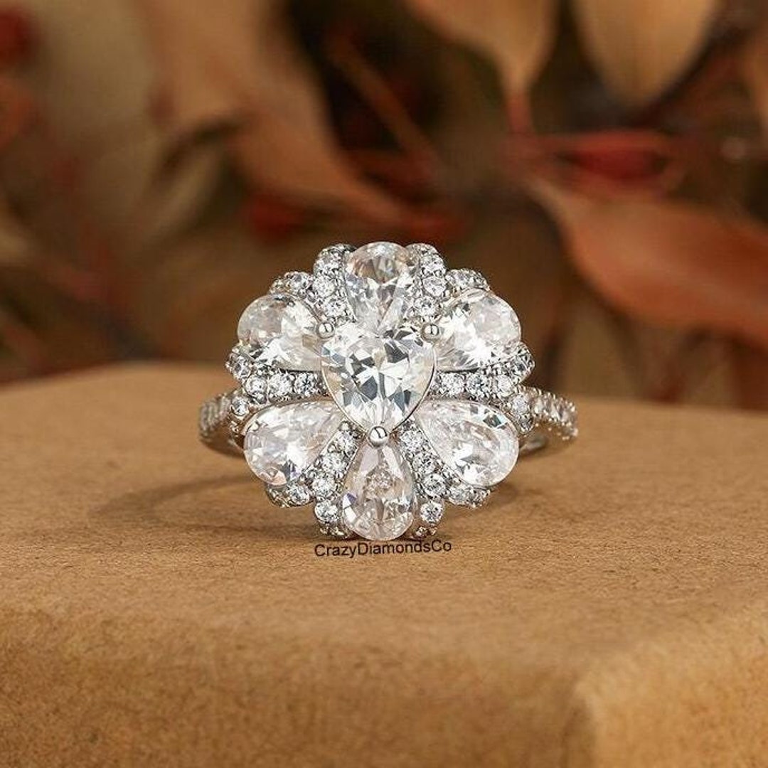 Engagement Ring With Teardrop Stones Enclosed in Petal Shapes With ...