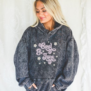 Mineral Black Hoodie Mockup: Photo of Model Wearing Black Colortone ...