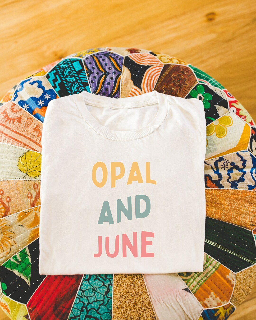 Mockup of Natural Tee Shirt Folded on Boho Patterned Cushion | Photo of ...