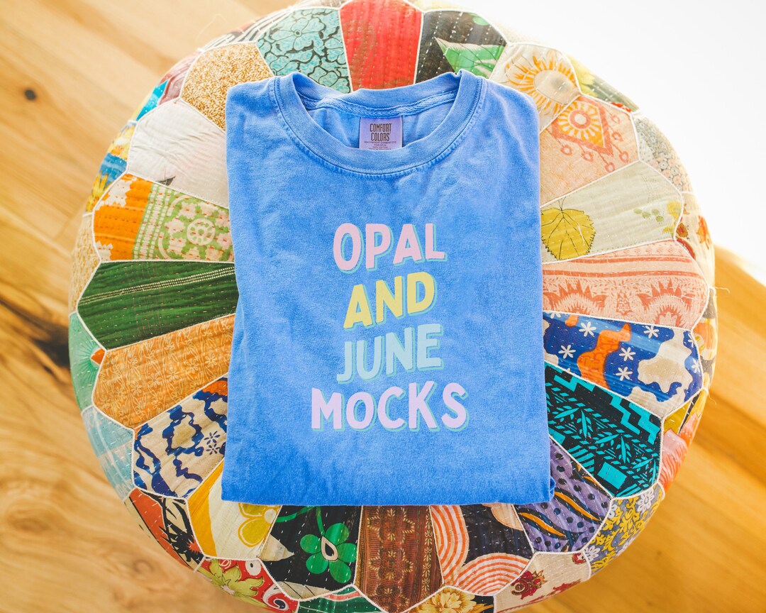 Mockup of Periwinkle Comfort Colors® Tee Shirt: Folded Blue Tee on Boho ...