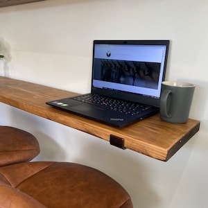 Wooden Breakfast Bar Wall Mounted on Stylish Steel Brackets With a ...