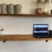 Wooden Breakfast Bar Wall Mounted on Stylish Steel Brackets With a ...
