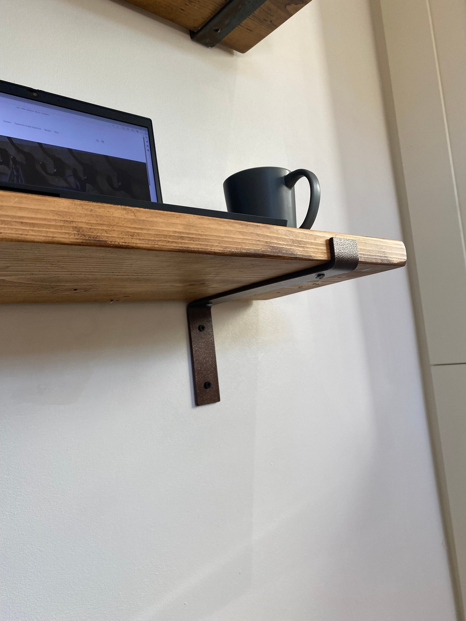 Wooden Breakfast Bar Wall Mounted on Stylish Steel Brackets With a ...