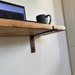 Wooden Breakfast Bar Wall Mounted on Stylish Steel Brackets With a ...