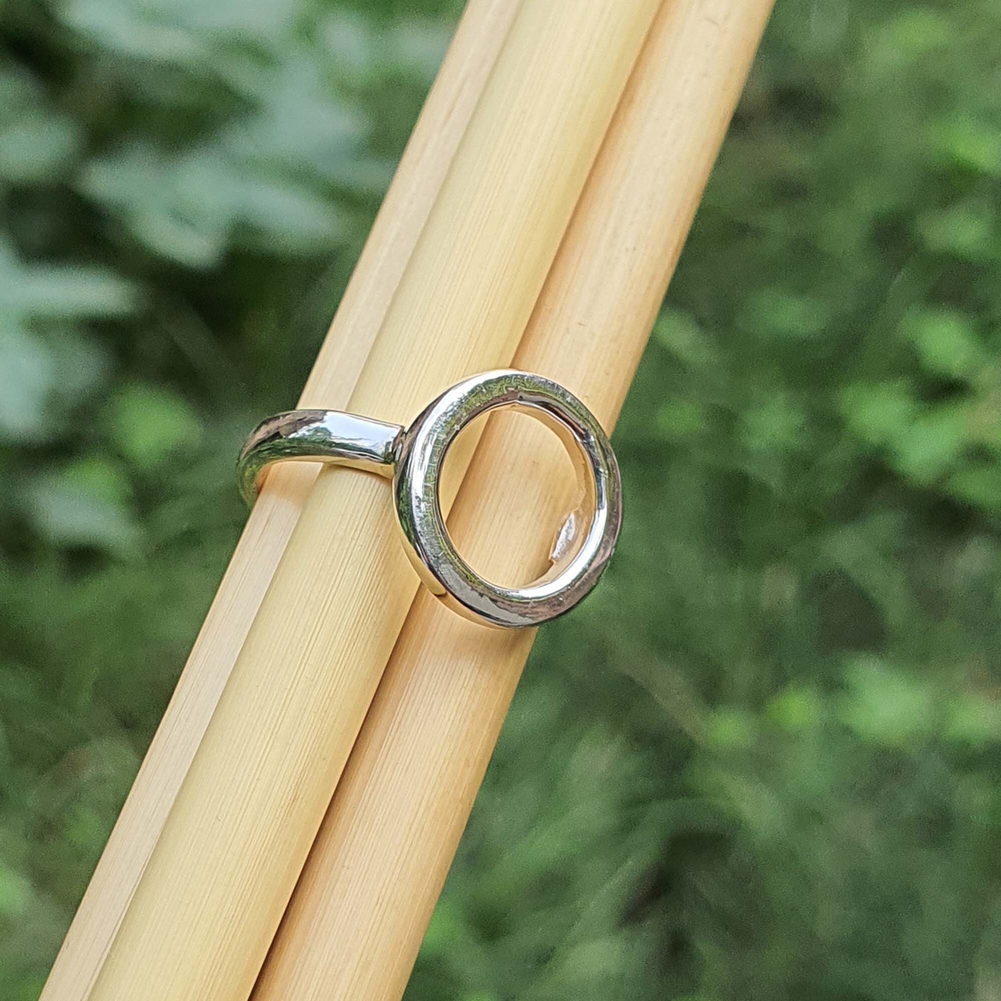 Circle with line through it ring store