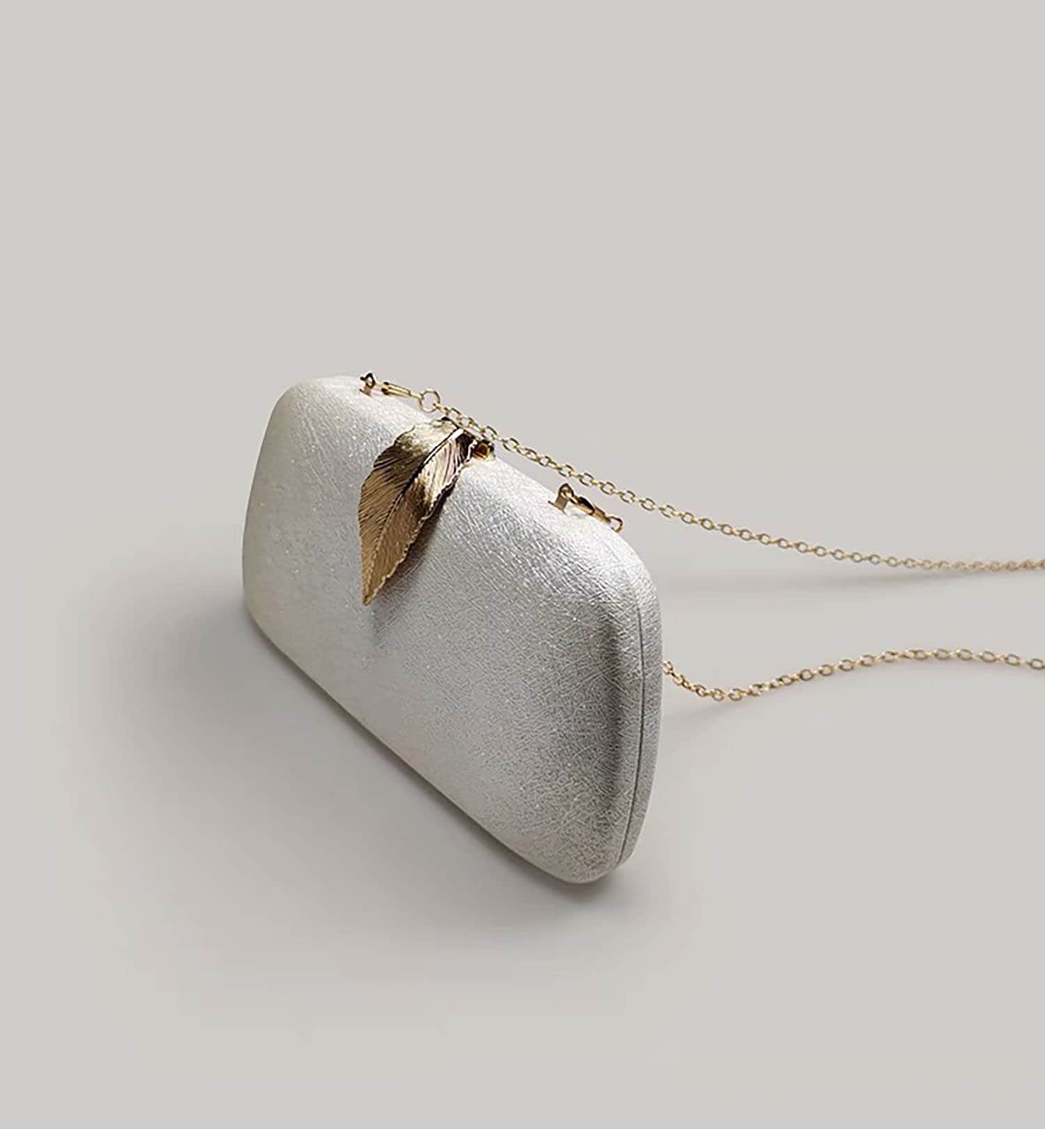 Classic Vintage Metallic Silver Clutch With Gold Leaf Clasp Clutches ...