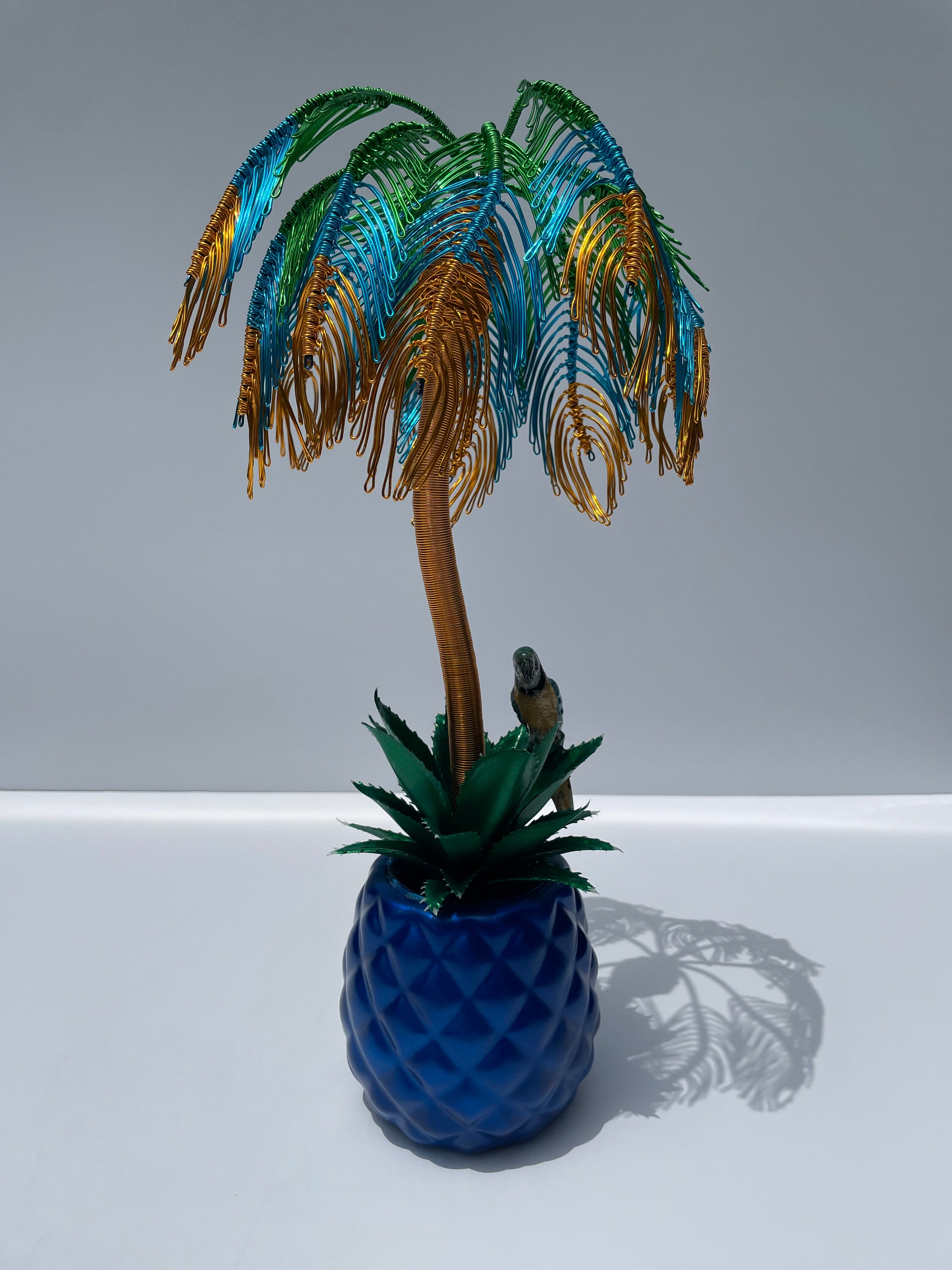 This is a Wire Palm Tree That Sits on a Porcelain Pineapple. This is a ...