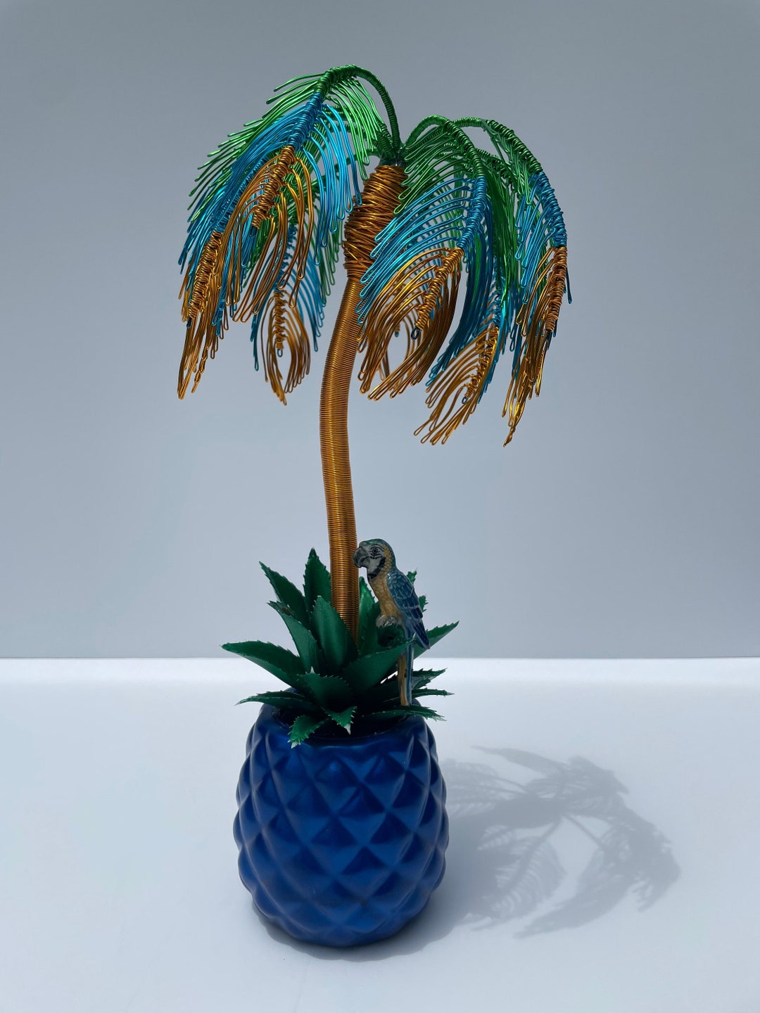 This is a Wire Palm Tree That Sits on a Porcelain Pineapple. This is a ...