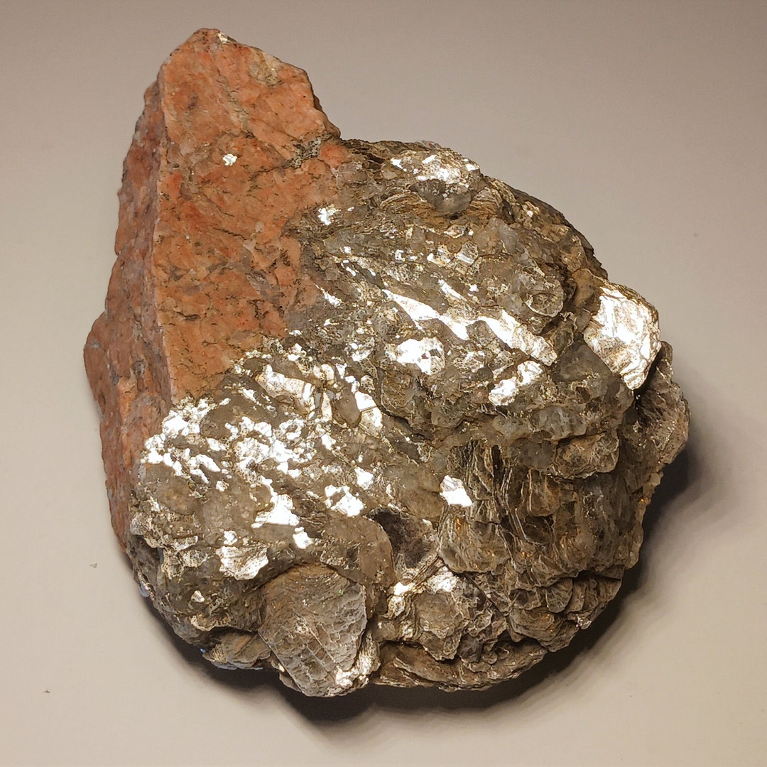 Glittering Silver Mica on Pink Microcline Feldspar, 357g. This is a ...