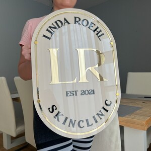 Beige Oval Sign With Golden and Black Letters, Golden Lining, Mounting ...