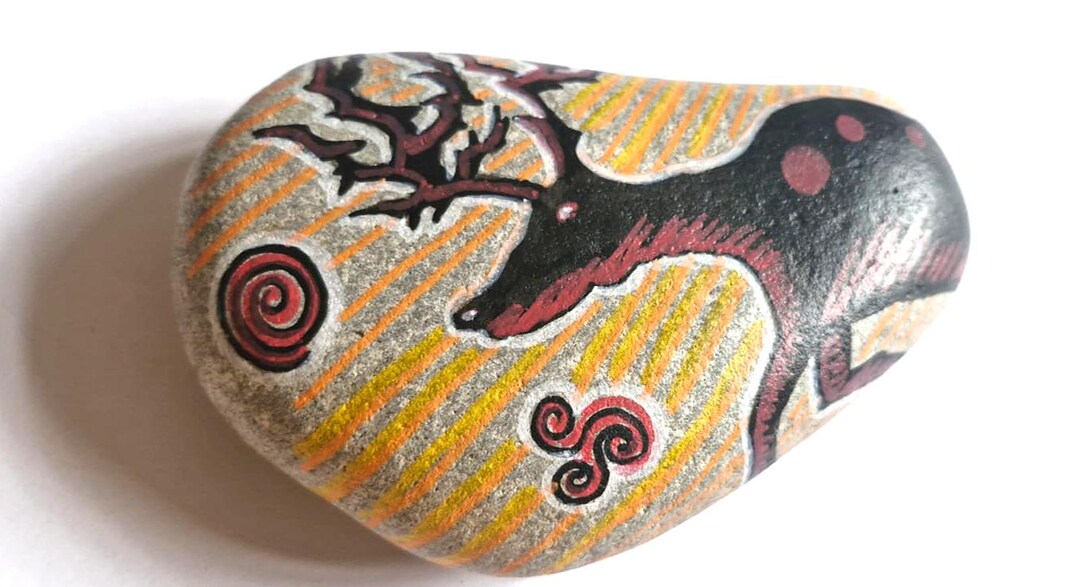 Large Beach Stones Decorated With Reimagined Prehistoric Cave Art ...