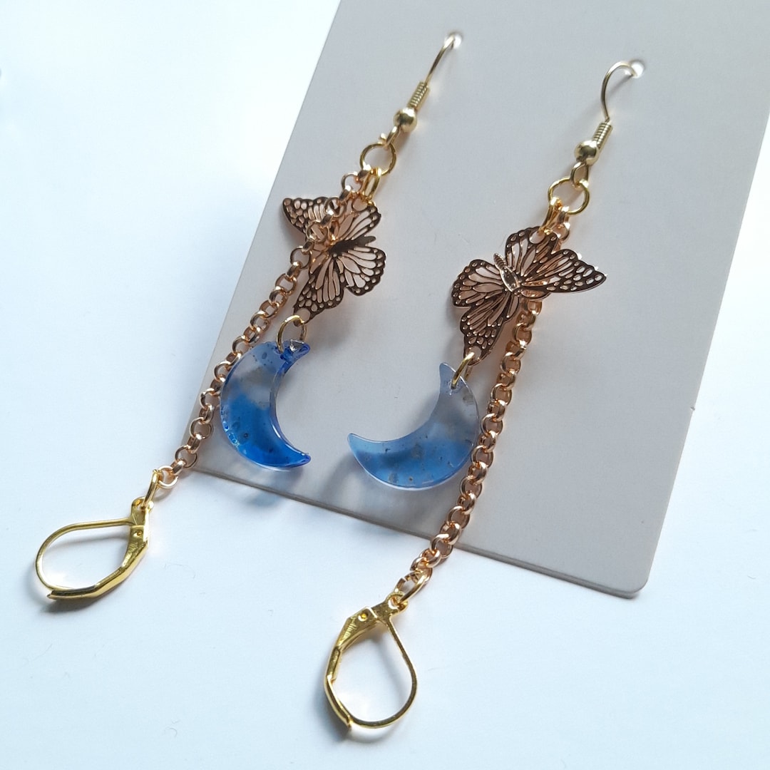 Goldene Fee Mond Loop Ohrstecker Ohrringe Filigraner Schmetterling und blaue Glasmond Anhänger ...