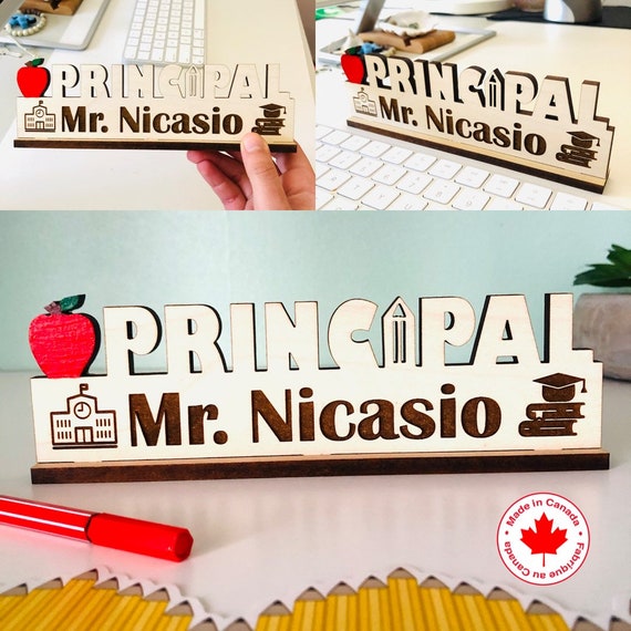 School Principal At Desk