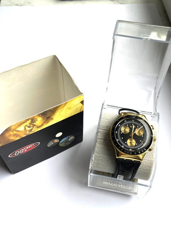 Swatch Irony Chrono GOLDFINGER YCG401, James Bond, ne… - Gem