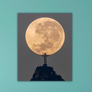 christ the redeemer moon behind