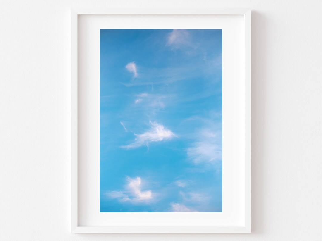 Small Wispy Clouds Print Over a Bright Blue Sky High Quality Photo ...