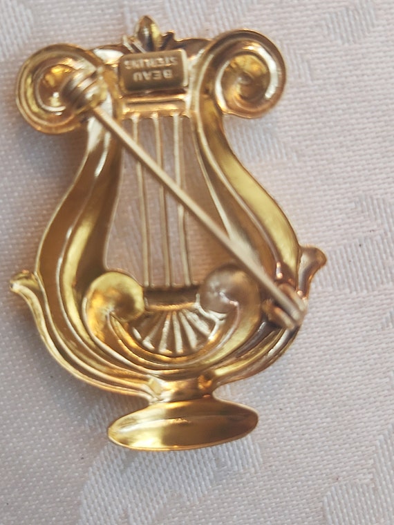 Musically Inspired - a Golden Harp Pin - Gem