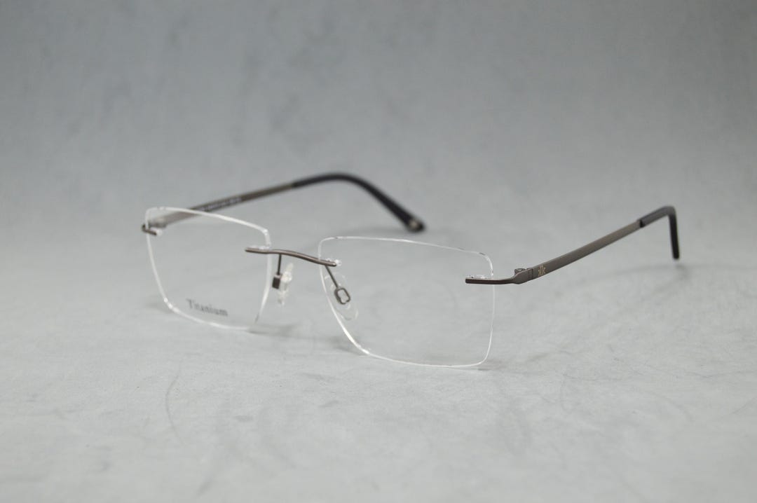 Top Rimless Eyeglasses. Pure Titanium ID Frame. New Selected Premium ...