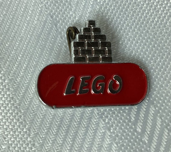 Lego pin Advertising, old font, stacked bricks on red… - Gem