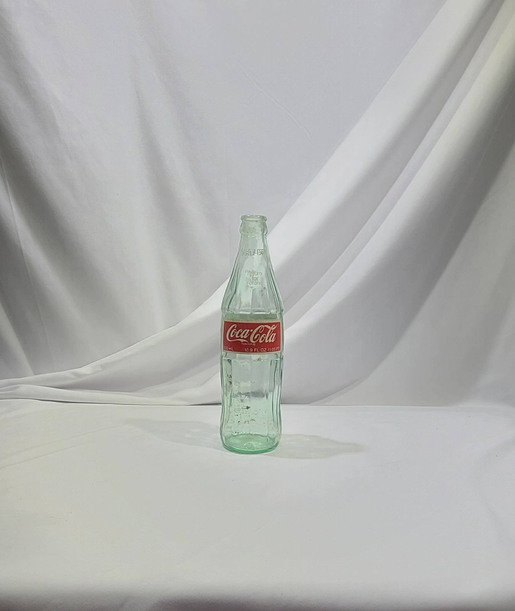 Empty Coca Cola Plastic Bottle