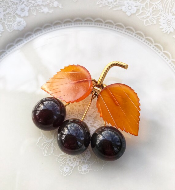 Carved amber pin cherries - Gem