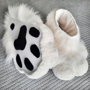 White Furry Feet Paws. White Puffy and Fluffy Fur Feet Paw With Black ...